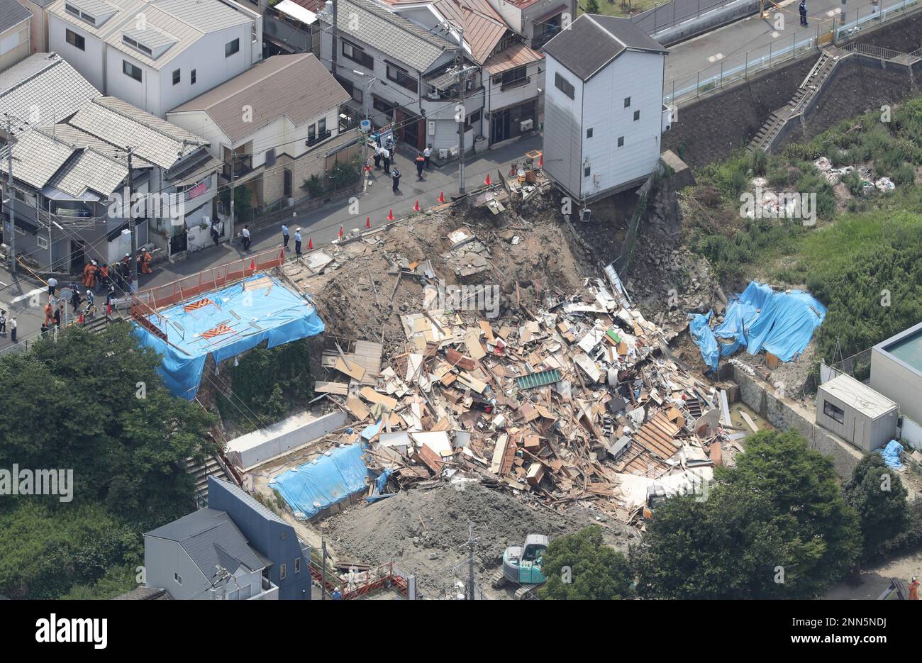 A two-story house near cliff collapses in Osaka City, Osaka Prefecture ...