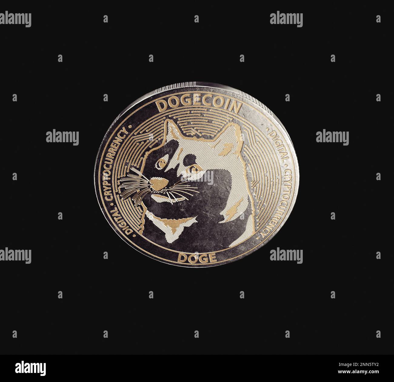 A dimly lit physical doge cryptocurrency in bronze and silver coin form ...