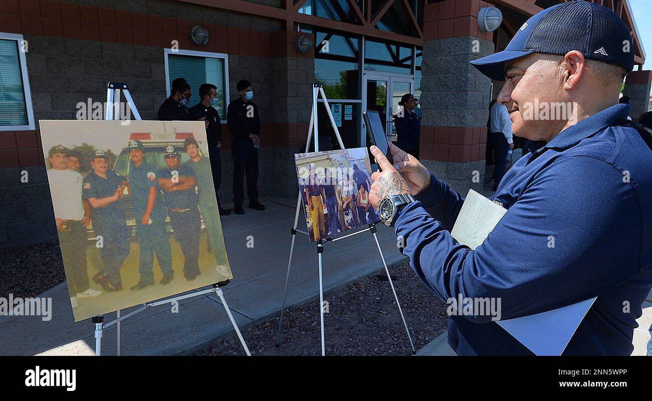Yuma Fire Department firefighter Pat Estrada takes a photo of an old ...