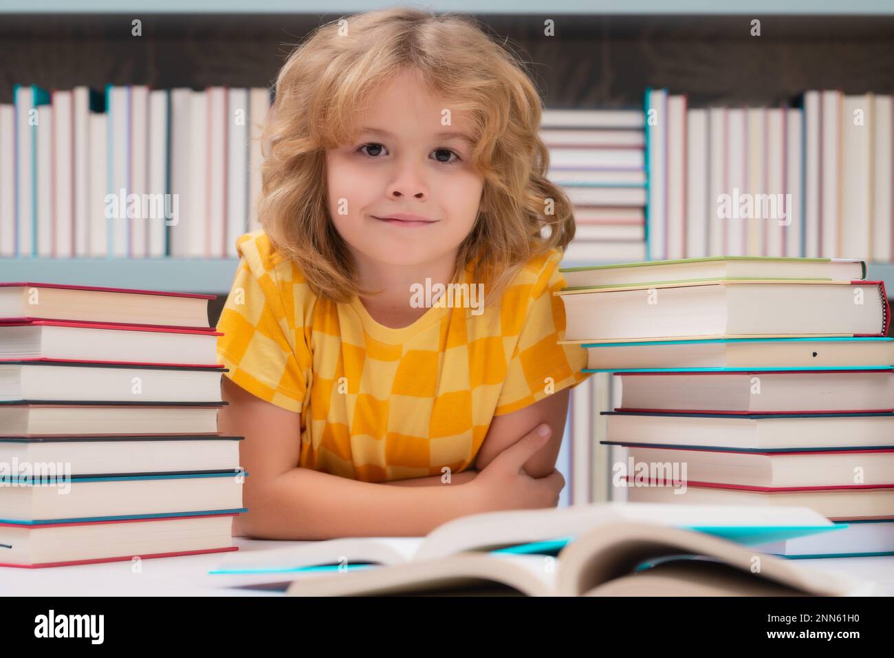 Nerd pupil. Kid on school library. Child reading book at school. Nerd ...