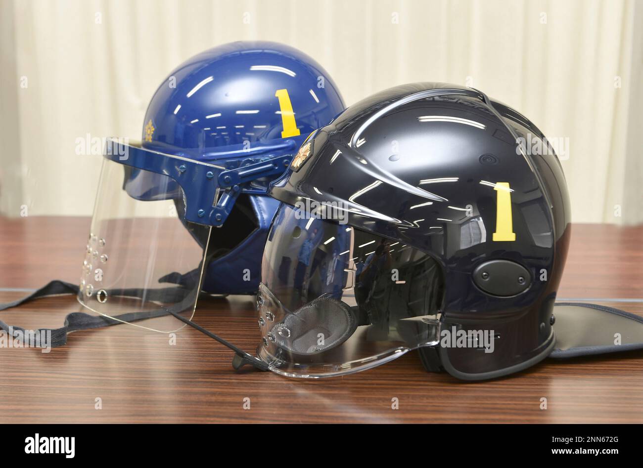 Old(L) and new types of helmets for Tokyo Metropolitan Police ...
