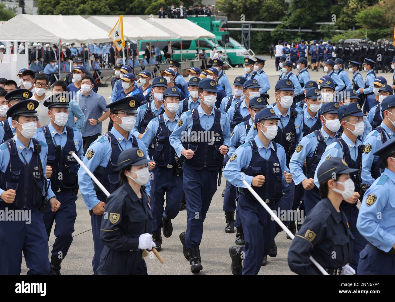 Officers of the Tokyo Metropolitan Police Department (TMPD), condunct a ...