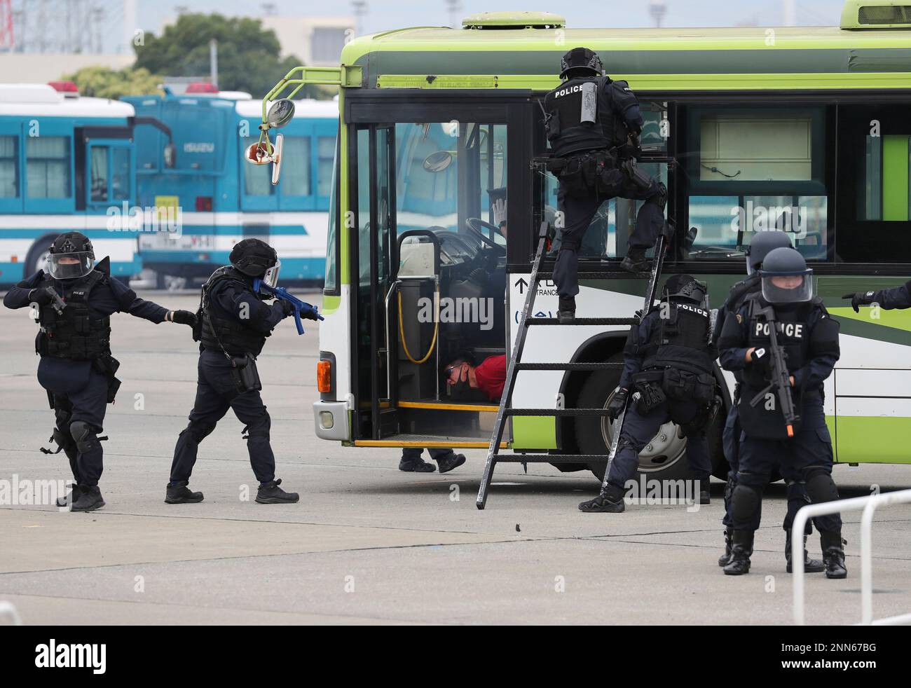 Officers of the Tokyo Metropolitan Police Department (TMPD), condunct a ...