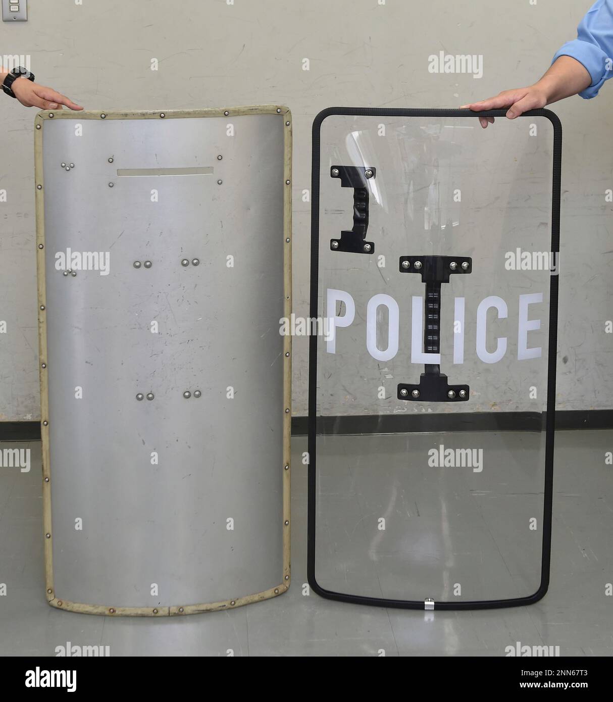 Old(L) and new types of shields for Tokyo Metropolitan Police ...