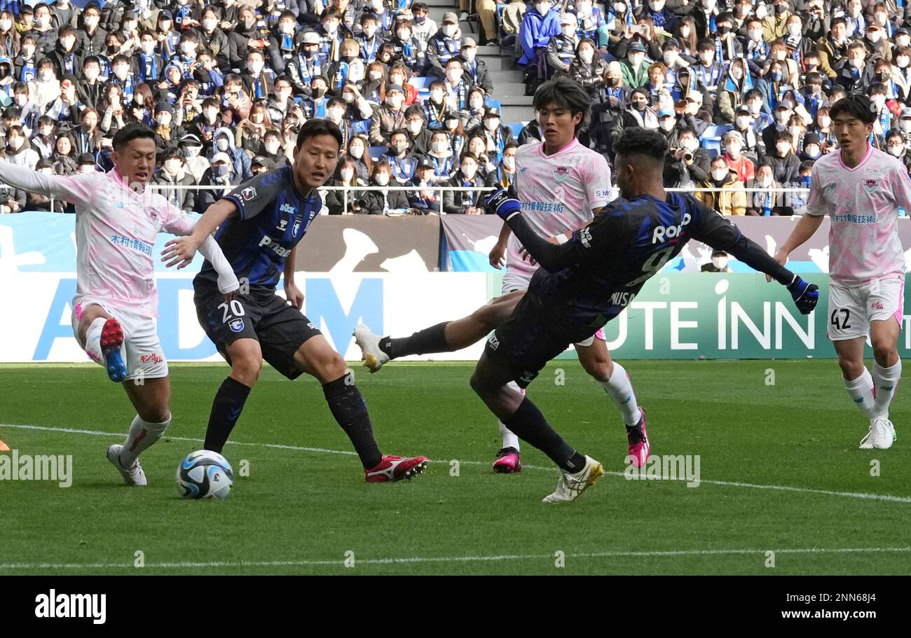 Gamba Osaka's forward Musashi Suzuki (R) opens a score during the ...