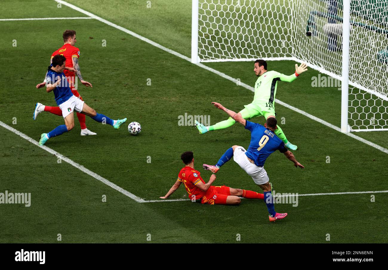 Wales' Joe Rodon, background left, and Italy's Federico Chiesa, left ...