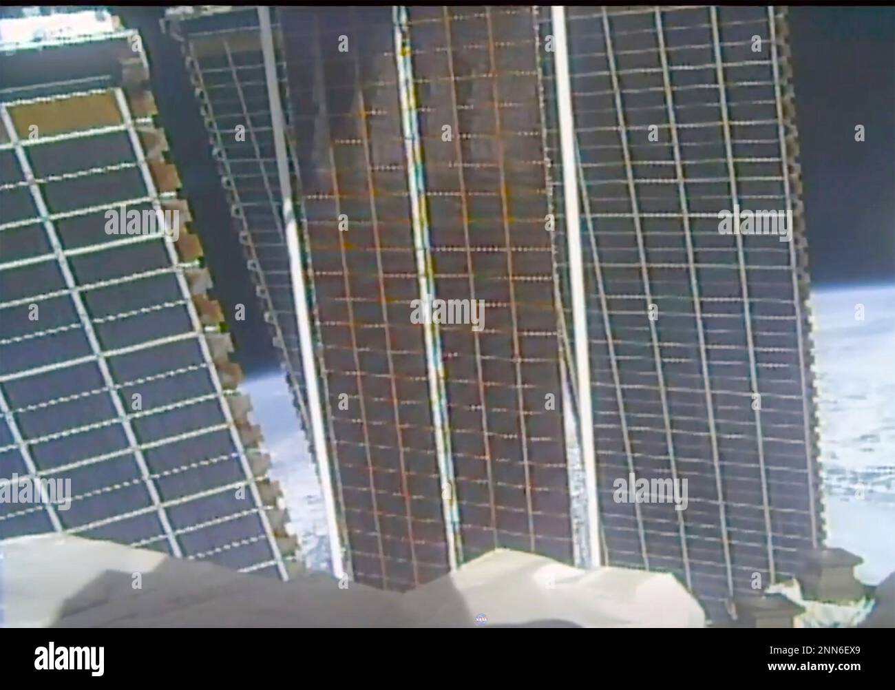 In this image taken from NASA video, a solar panel, center, is unfolded ...