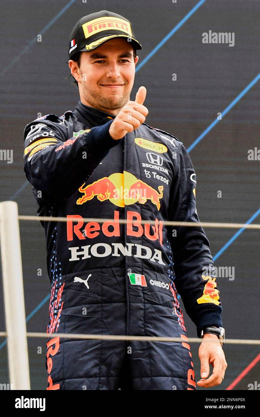 Red Bull driver Sergio Perez of Mexico celebrates from the podium his ...