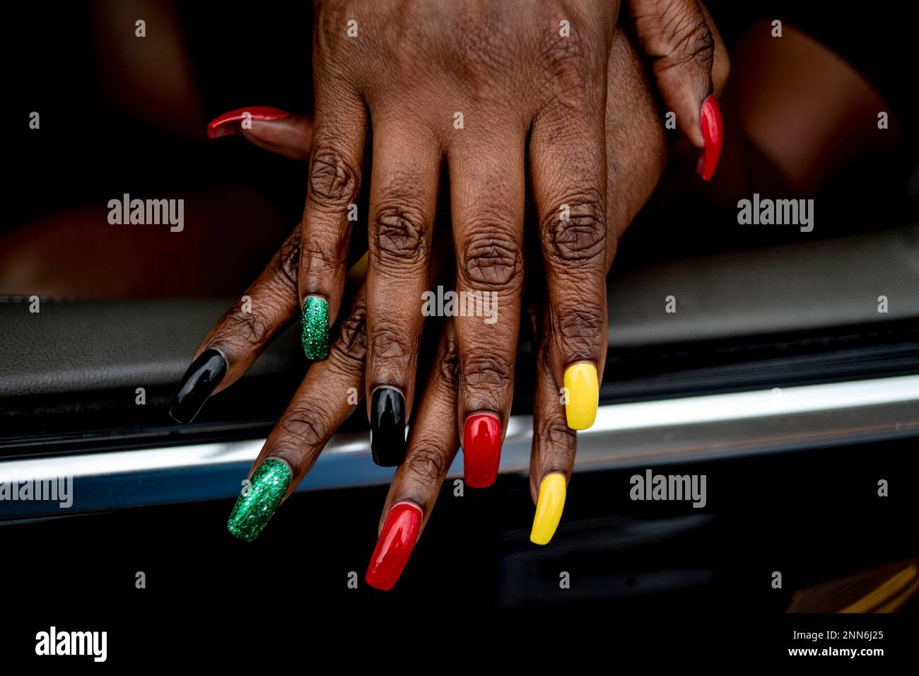 Flint resident Tracy Palmer shows off her Juneteenth-inspired nails ...