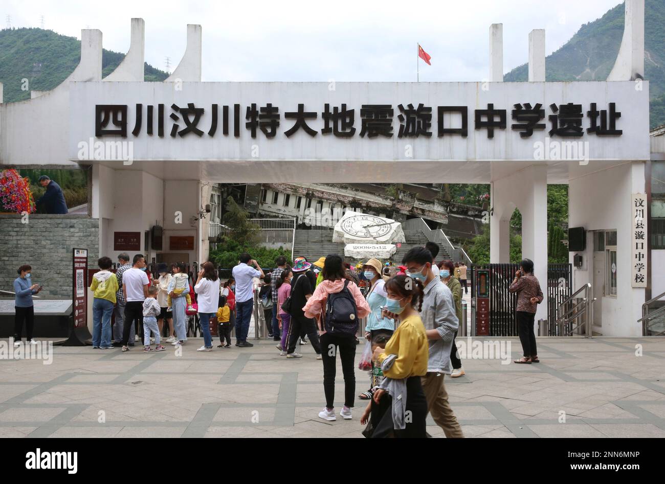 People visit the site of a junior high school where the school building ...