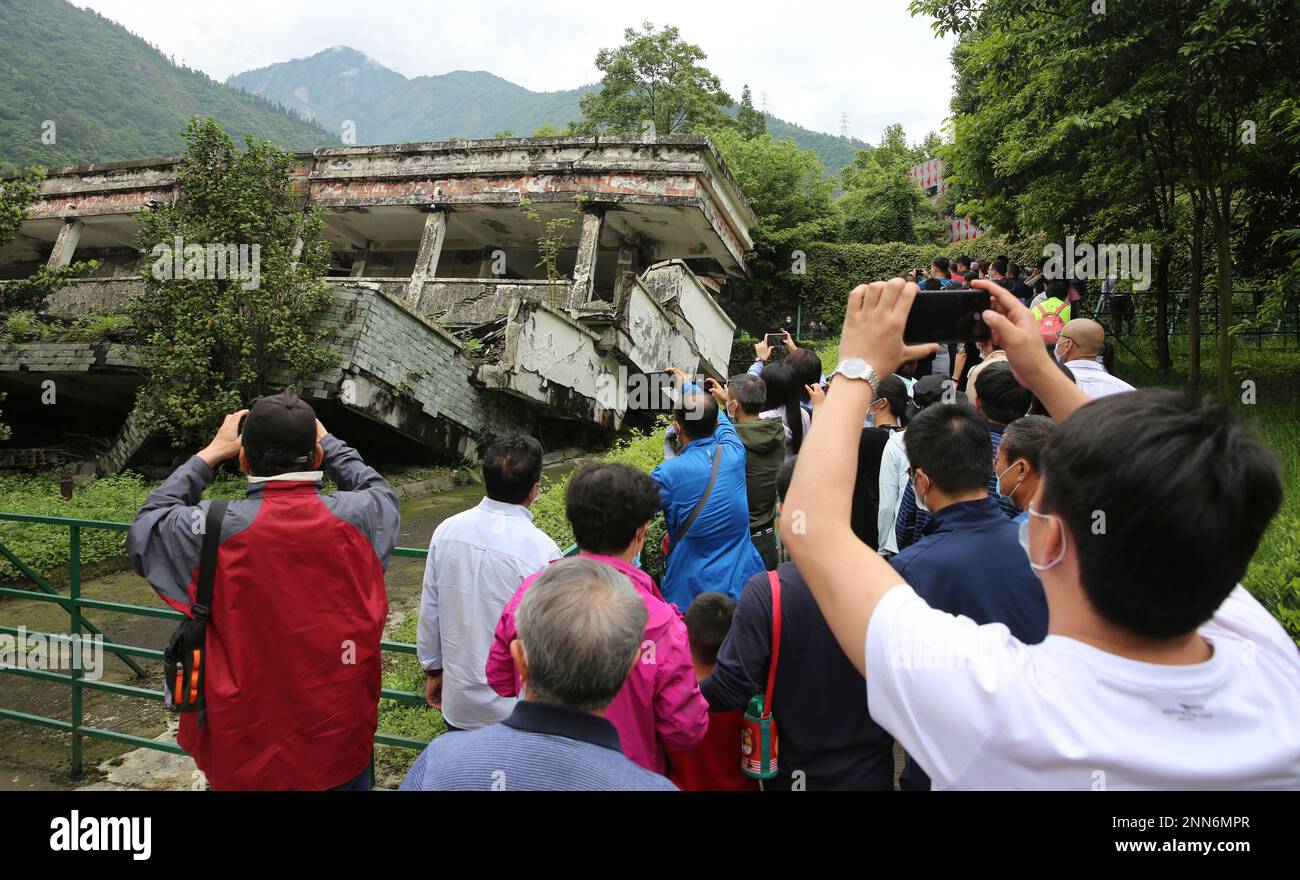 People visit the site of a junior high school where the school building ...