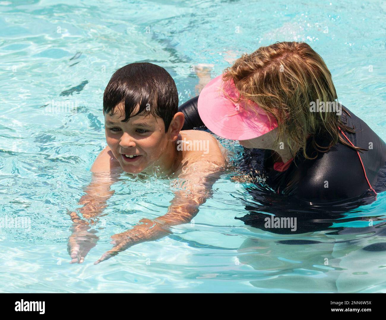 Kim Tyler, a volunteer instructor, helps Landyn Rowe, 10, during the ...