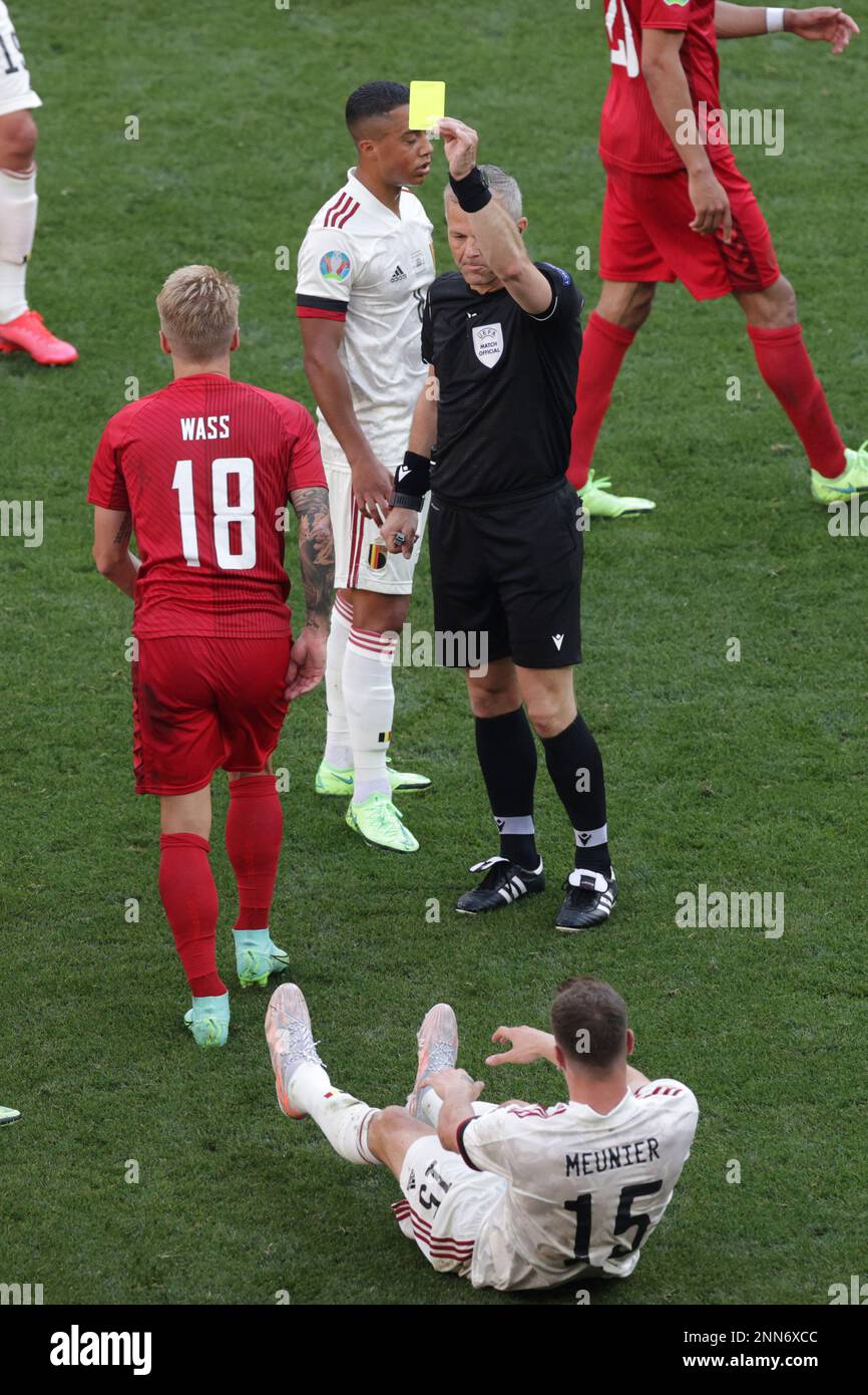 Denmark's Daniel Wass, left, is shown a yellow card during the Euro ...