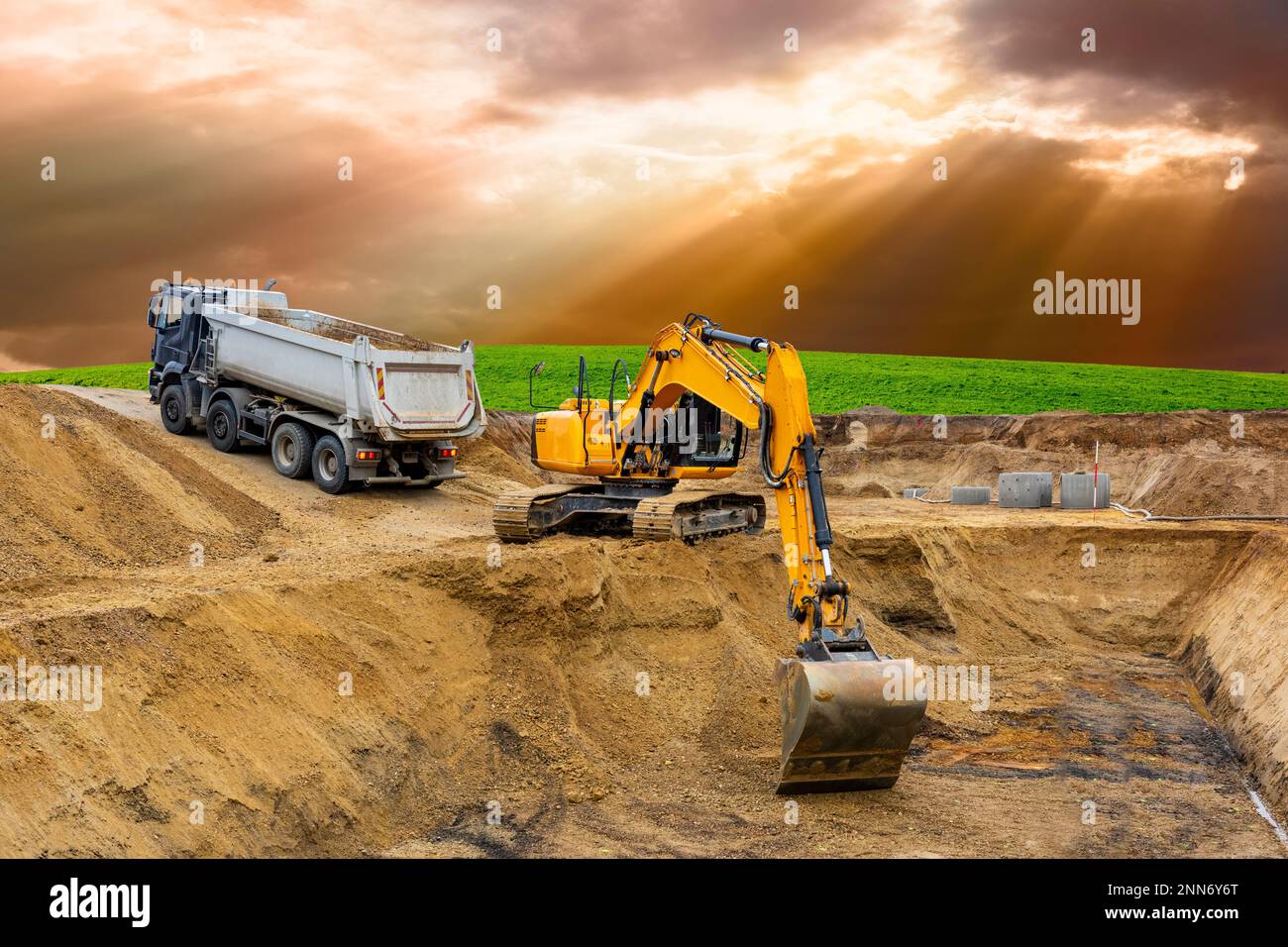 excavator is digging and working at construction site Stock Photo - Alamy