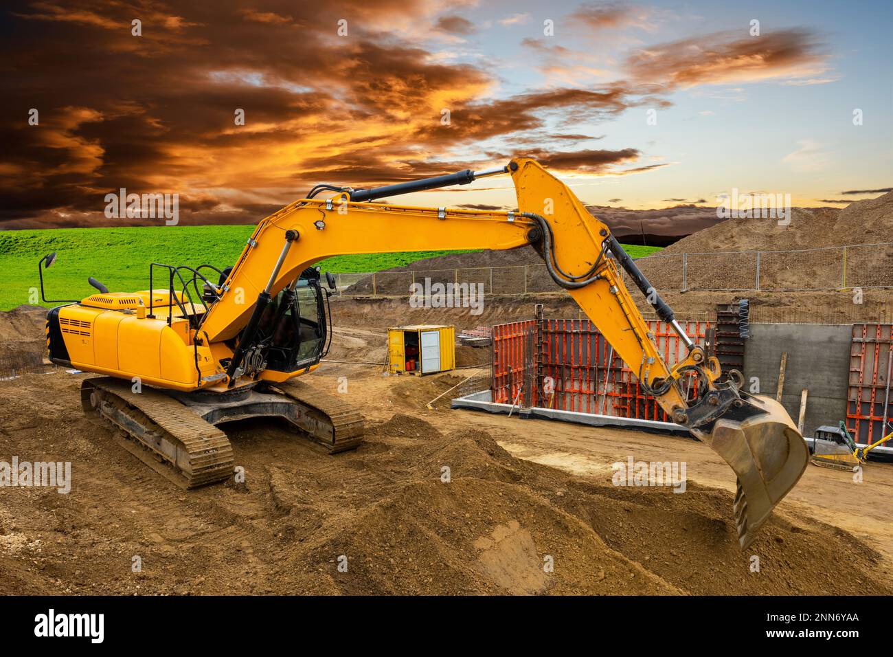 excavator is digging and working at construction site Stock Photo - Alamy