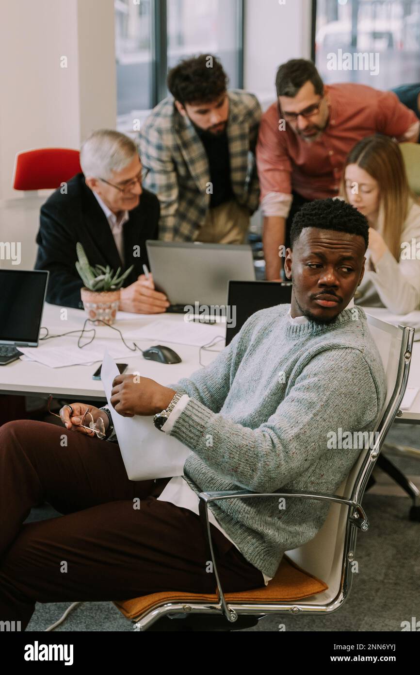 A young successful businessman was distracted by something while ...