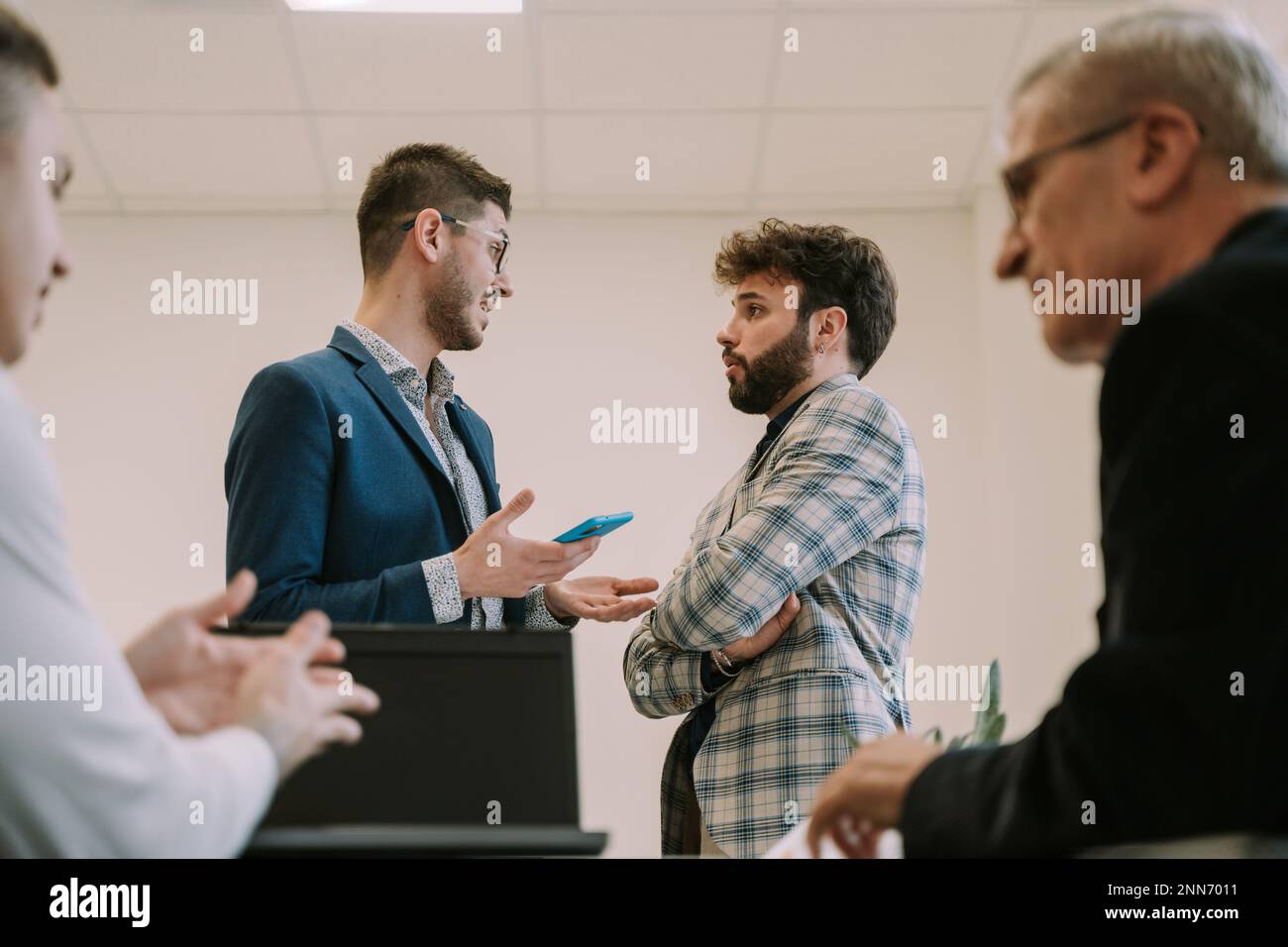 Two men stand engaged hi-res stock photography and images - Alamy