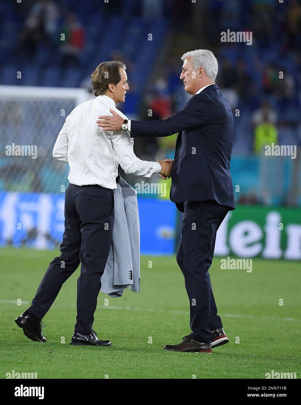Italy's manager Roberto Mancini, left, meets Switzerland's manager ...