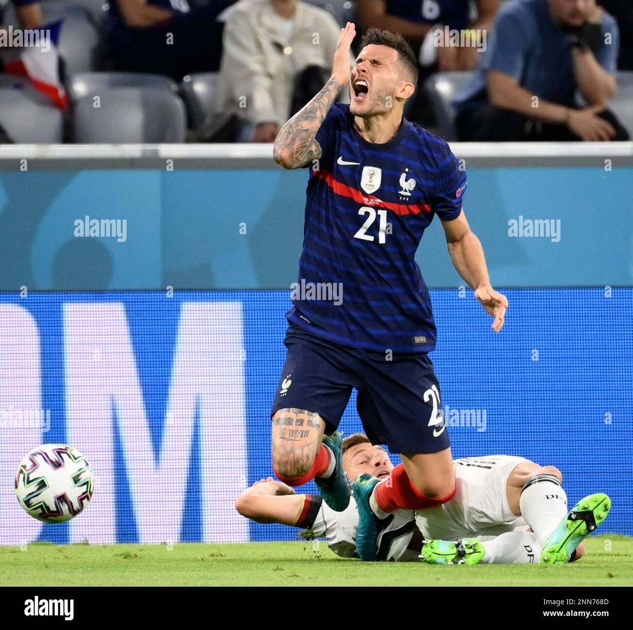 Germany's Joshua Kimmich, back, challenges France's Lucas Hernandez ...