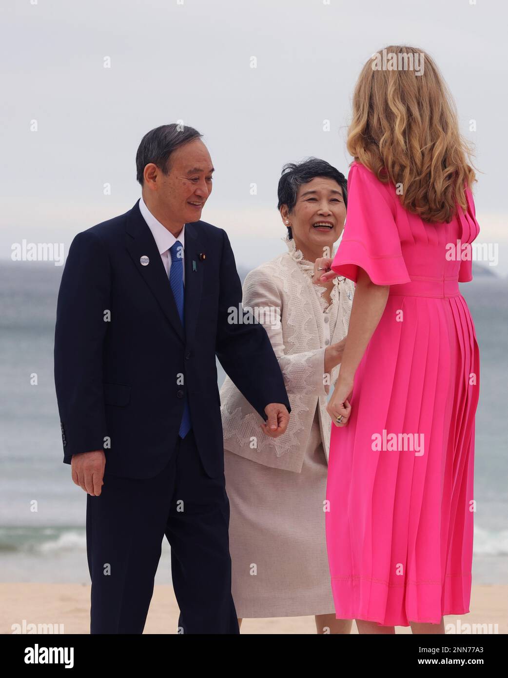 Japanese Prime Minister Yoshihide Suga and his wife Mariko are greeted ...
