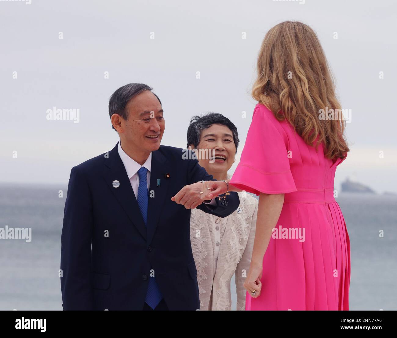 Japanese Prime Minister Yoshihide Suga and his wife Mariko are greeted ...