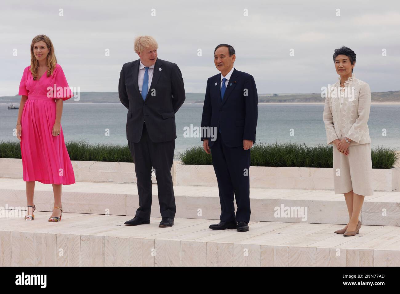 Japanese Prime Minister Yoshihide Suga and his wife Mariko are greeted ...