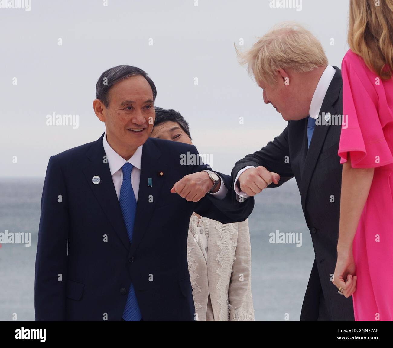 Japanese Prime Minister Yoshihide Suga and his wife Mariko are greeted ...