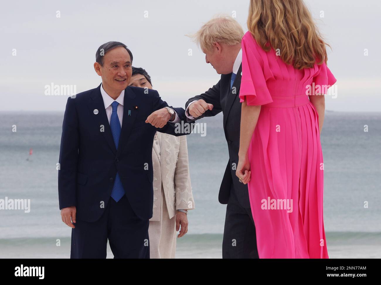 Japanese Prime Minister Yoshihide Suga and his wife Mariko are greeted ...