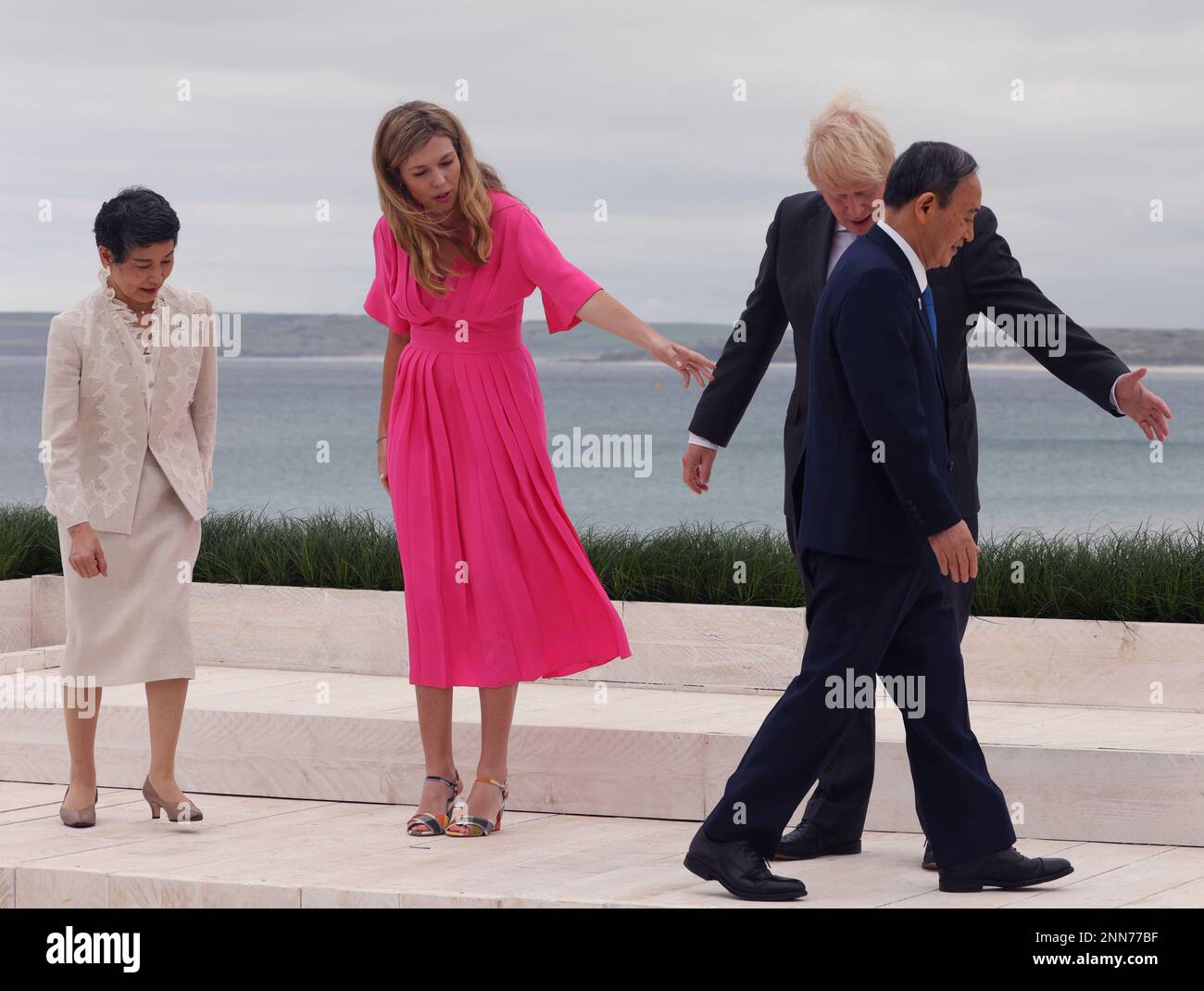 Japanese Prime Minister Yoshihide Suga and his wife Mariko are greeted ...
