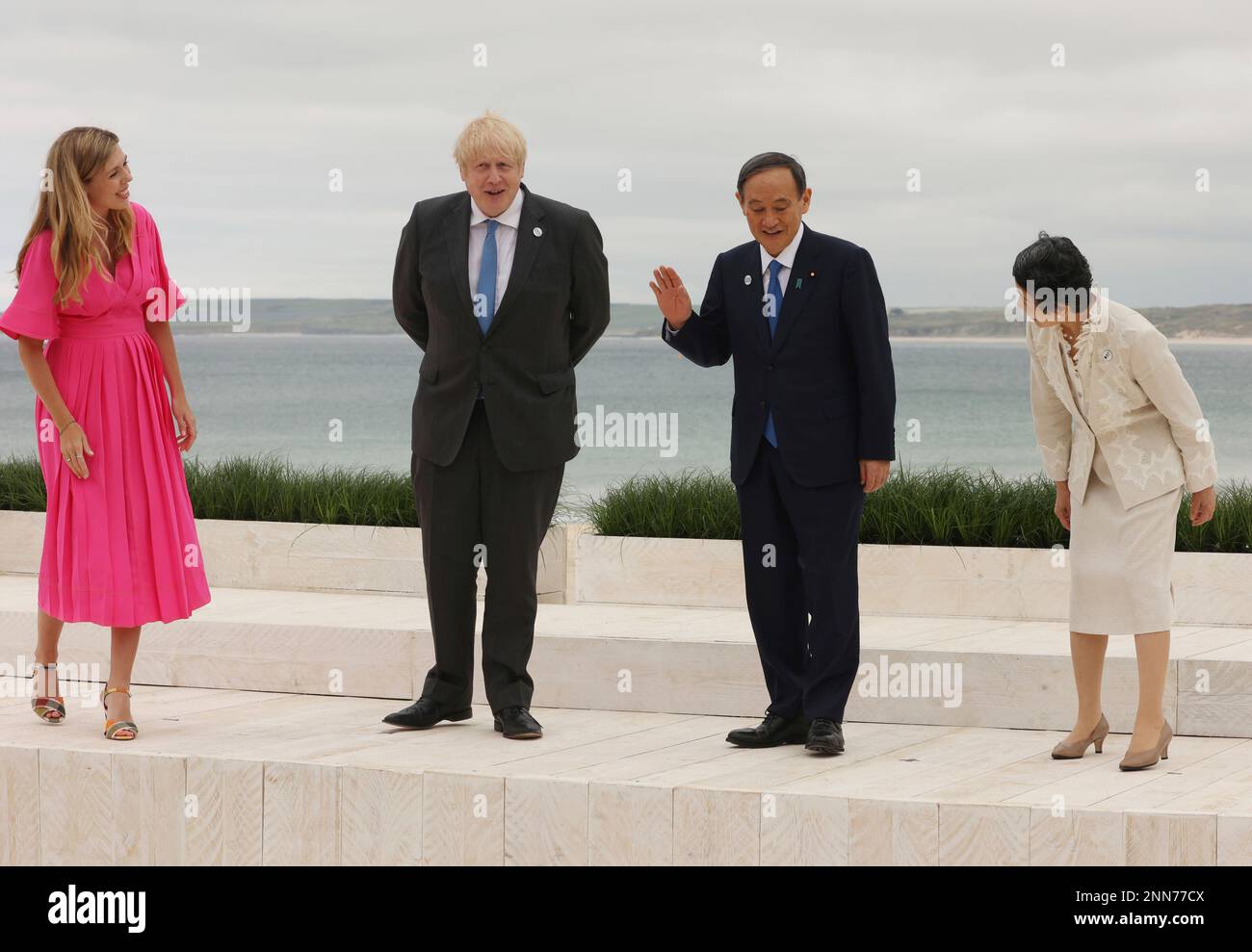 Japanese Prime Minister Yoshihide Suga and his wife Mariko are greeted ...