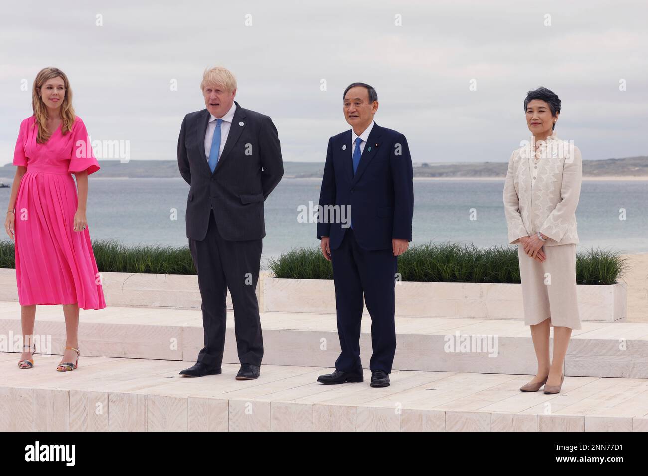 Japanese Prime Minister Yoshihide Suga and his wife Mariko are greeted ...