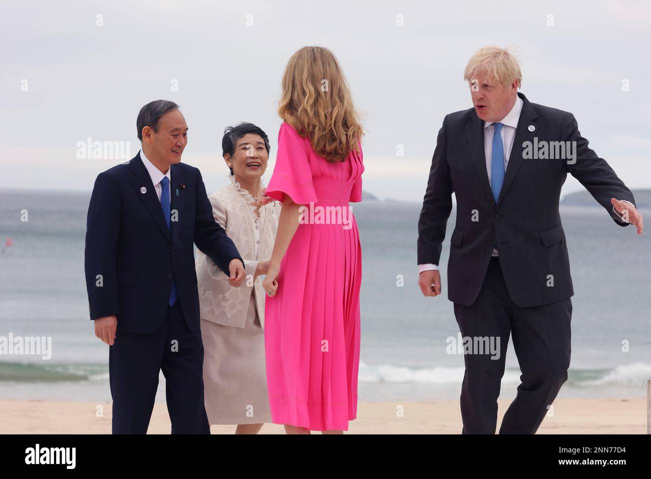 Japanese Prime Minister Yoshihide Suga and his wife Mariko are greeted ...