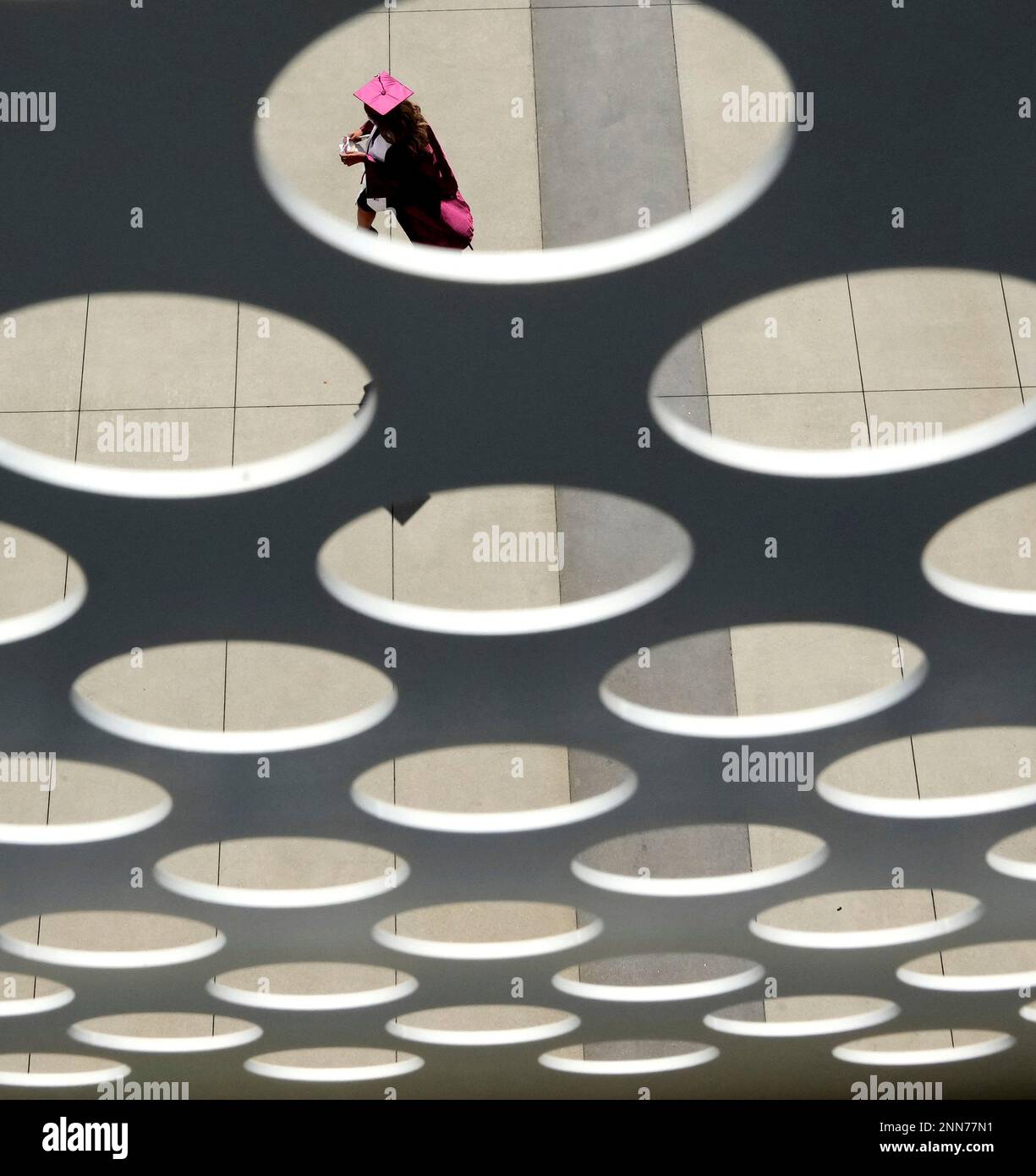 A graduate makes her way to the staging area during the 2021 Mt. Sac ...