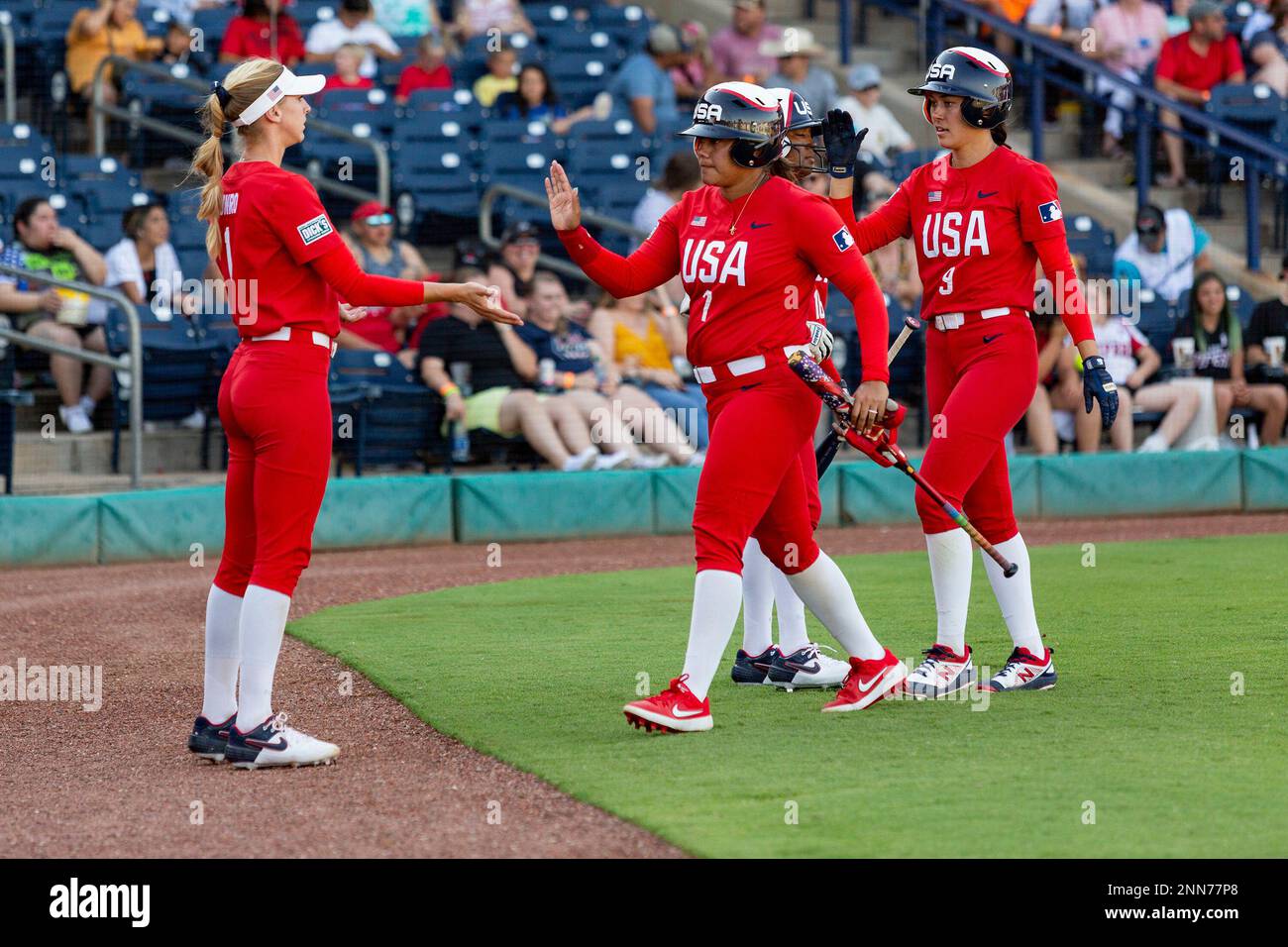 Team USA's Kelsey Stewart (7) and Janie Reed (9) high five teammates ...