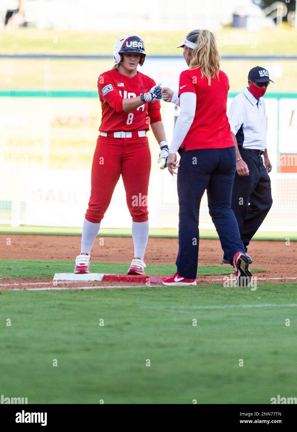 Team USA's Haylie McCleney (8) gives knuckles to her assistant coach ...