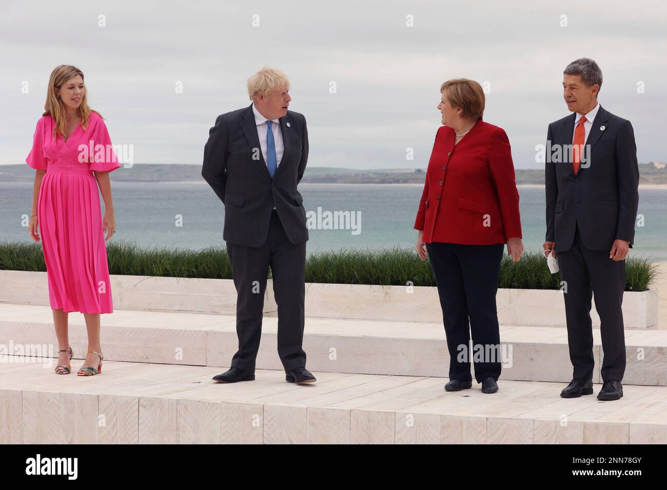 German Prime Minister Angela Merkel and her husband Ulrich are greeted ...