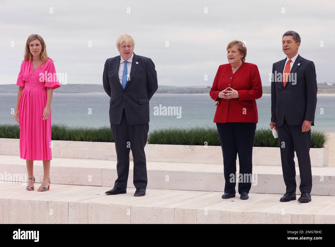 German Prime Minister Angela Merkel and her husband Ulrich are greeted ...