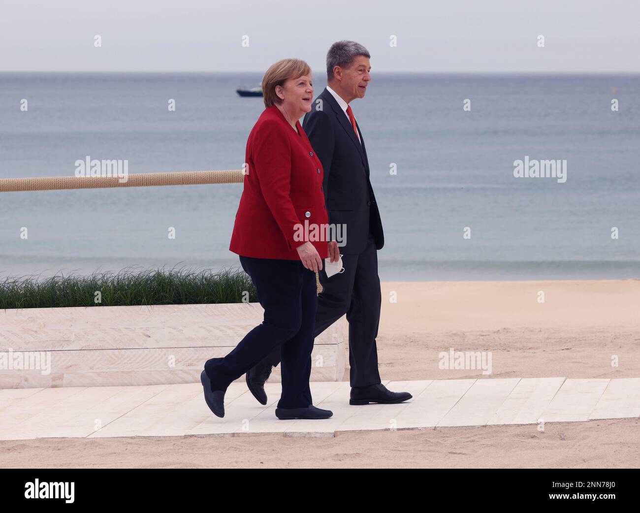 German Prime Minister Angela Merkel and her husband Ulrich head for the ...
