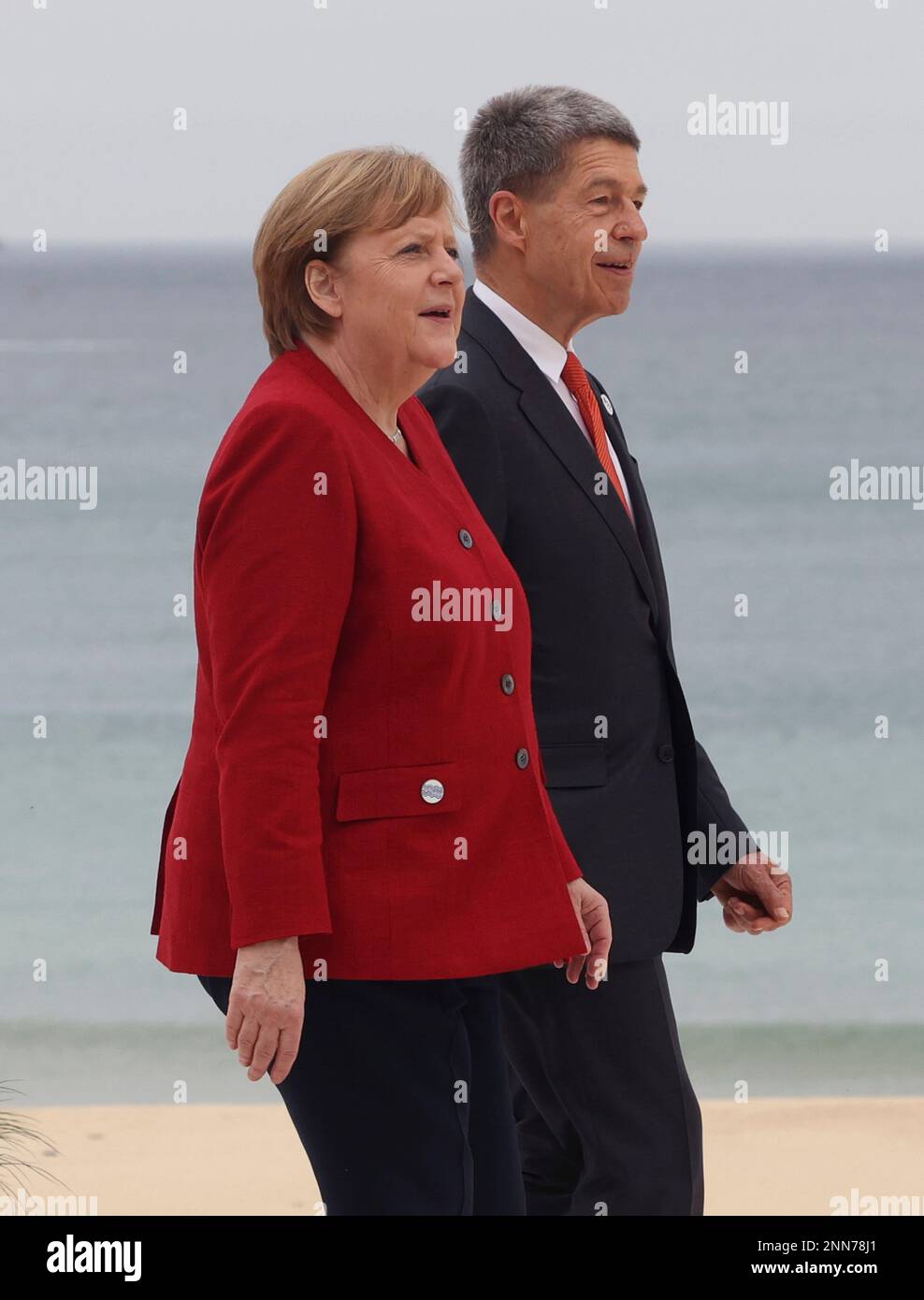 German Prime Minister Angela Merkel and her husband Ulrich head for the ...