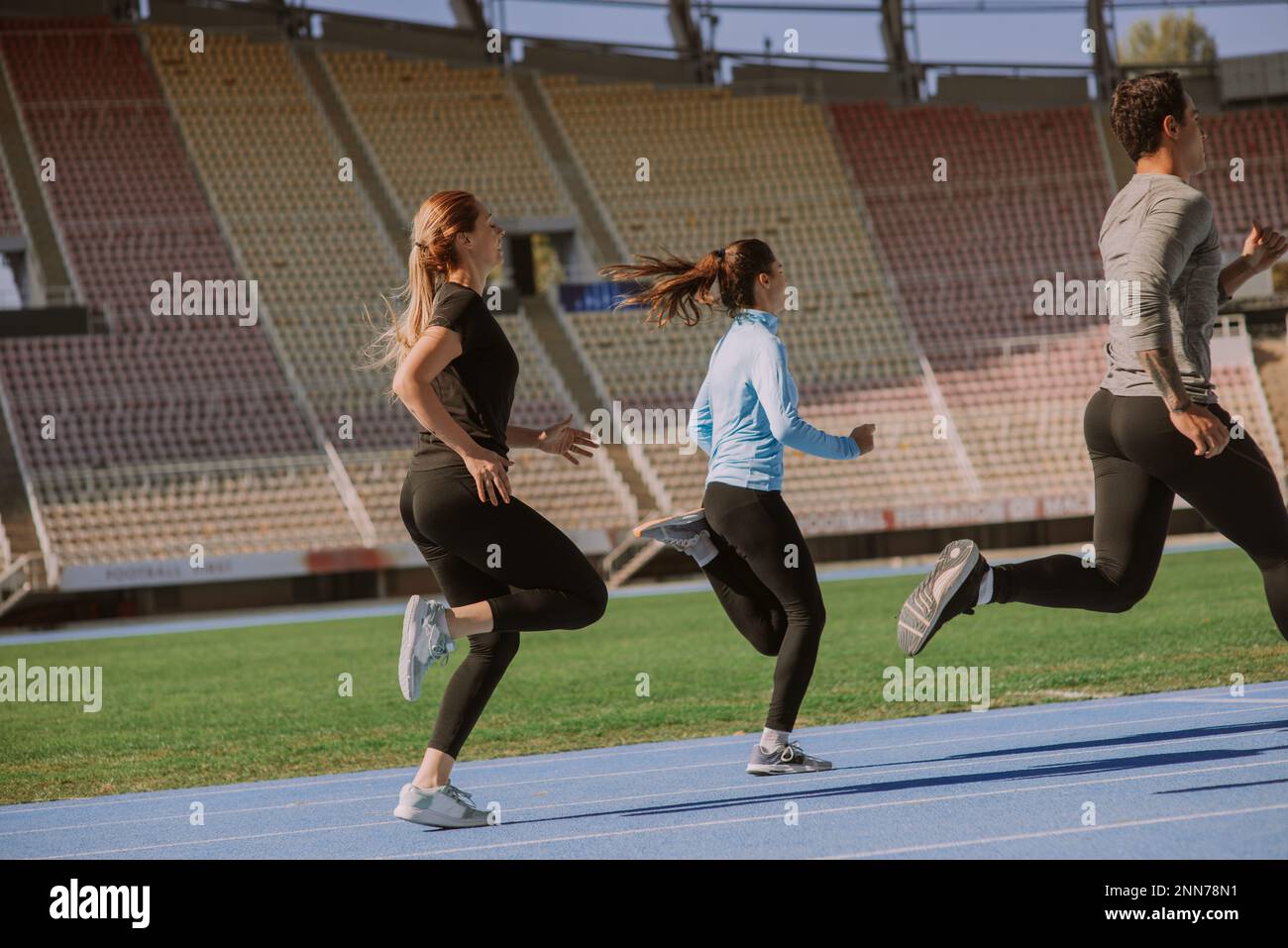 Three sportspeople hi-res stock photography and images - Alamy