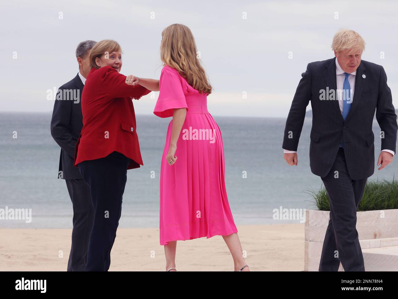 German Prime Minister Angela Merkel is greeted by Prime Minister of ...