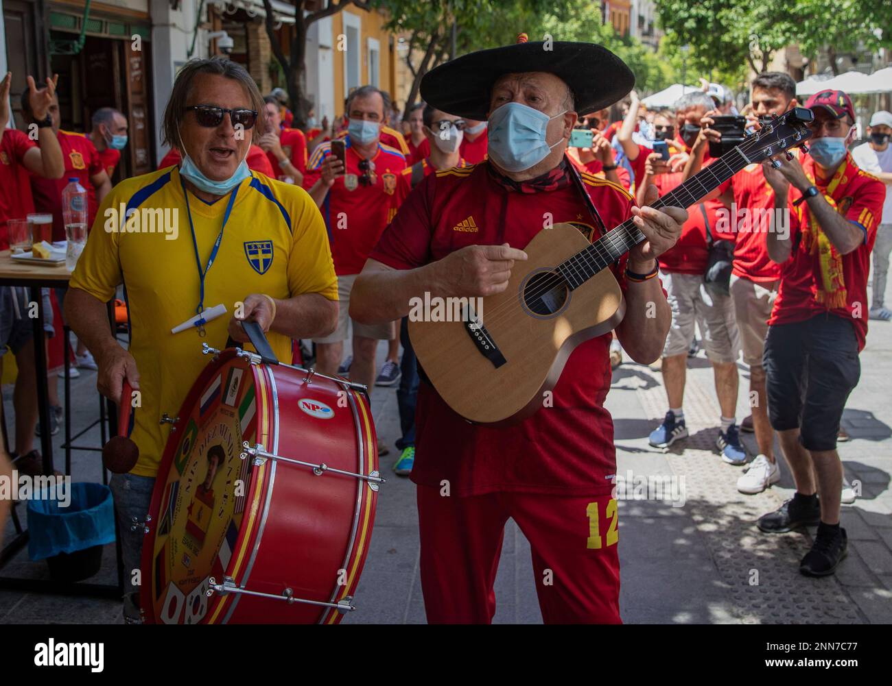 Spain's national team cheerleader Manolo 'el del Bombo' (r) swaps the ...