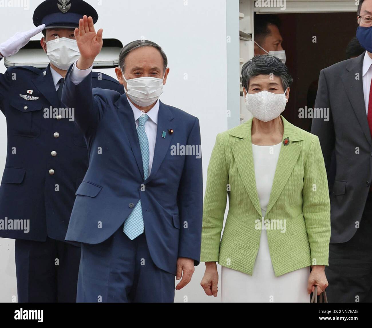 Japanese Prime Minister Yoshihide Suga and his wife Mariko arrive at ...