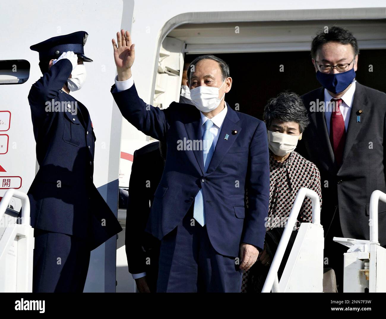 Japanese Prime Minister Yoshihide Suga and his wife Mariko leave for ...