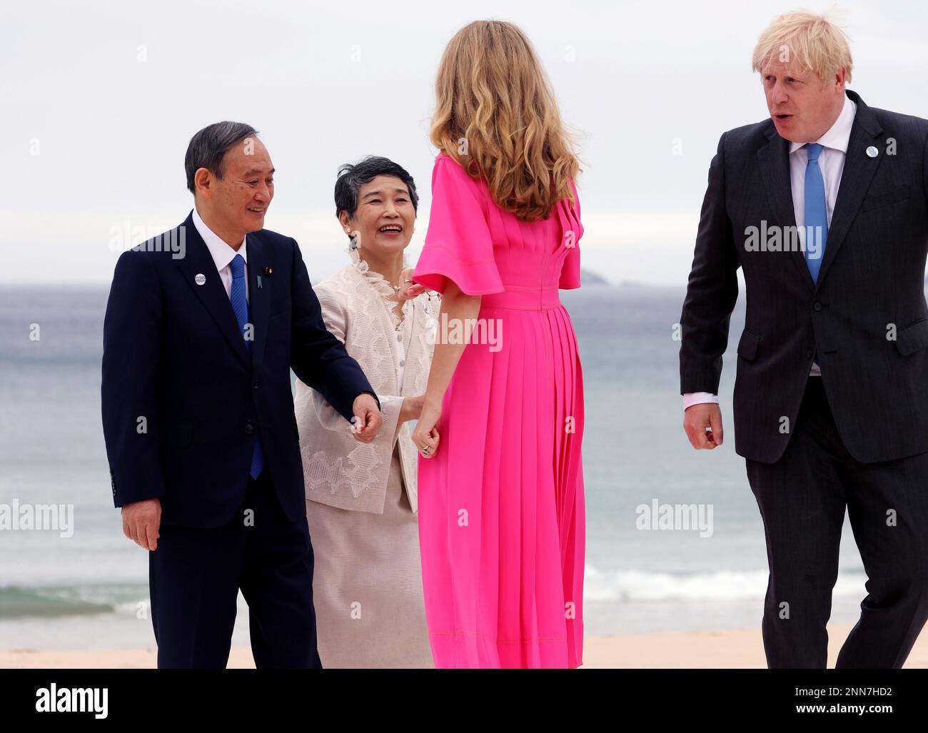 Japanese Prime Minister Yoshihide Suga and his wife Mariko are greeted ...