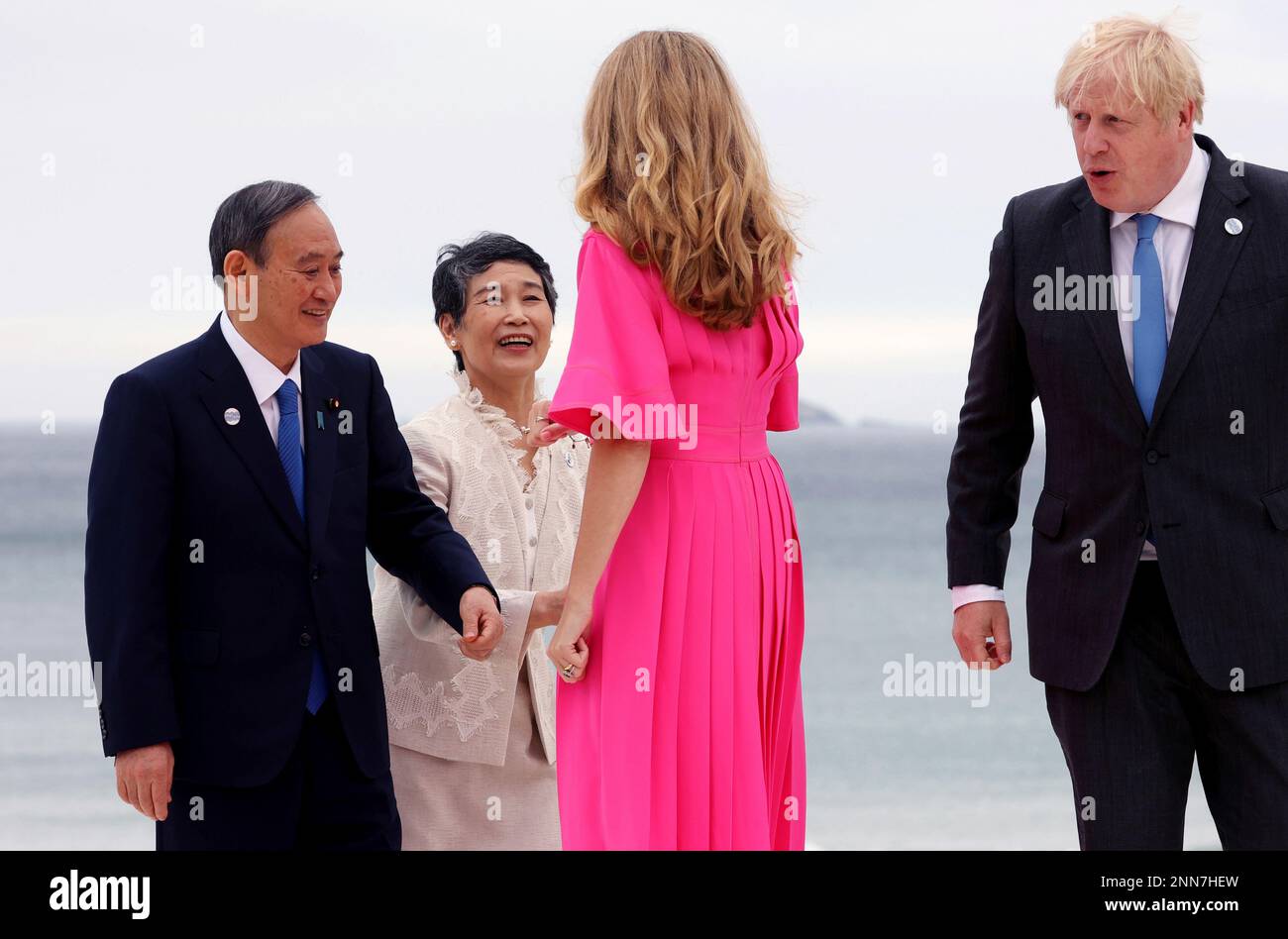 Japanese Prime Minister Yoshihide Suga and his wife Mariko are greeted ...