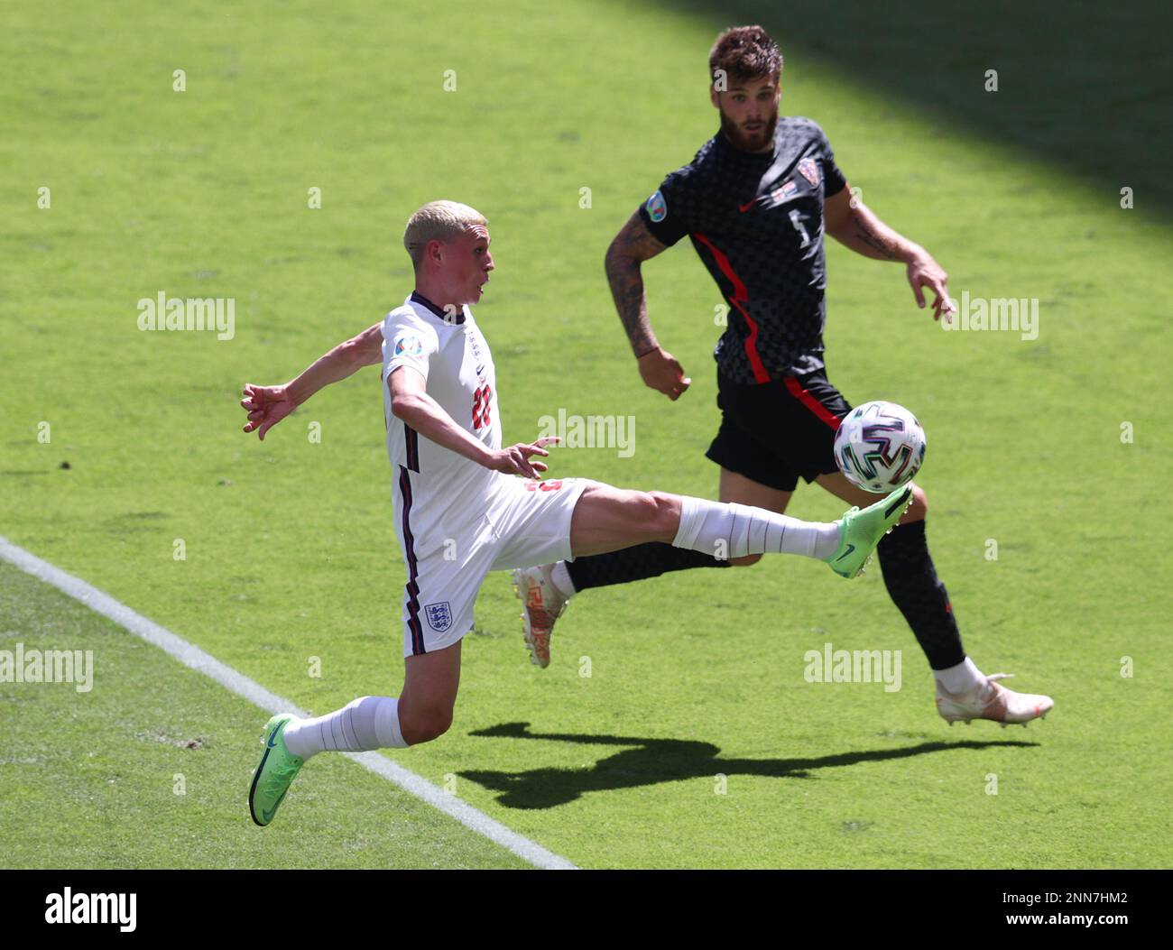 England's Phil Foden attempts to control the ball as Croatia's Duje ...