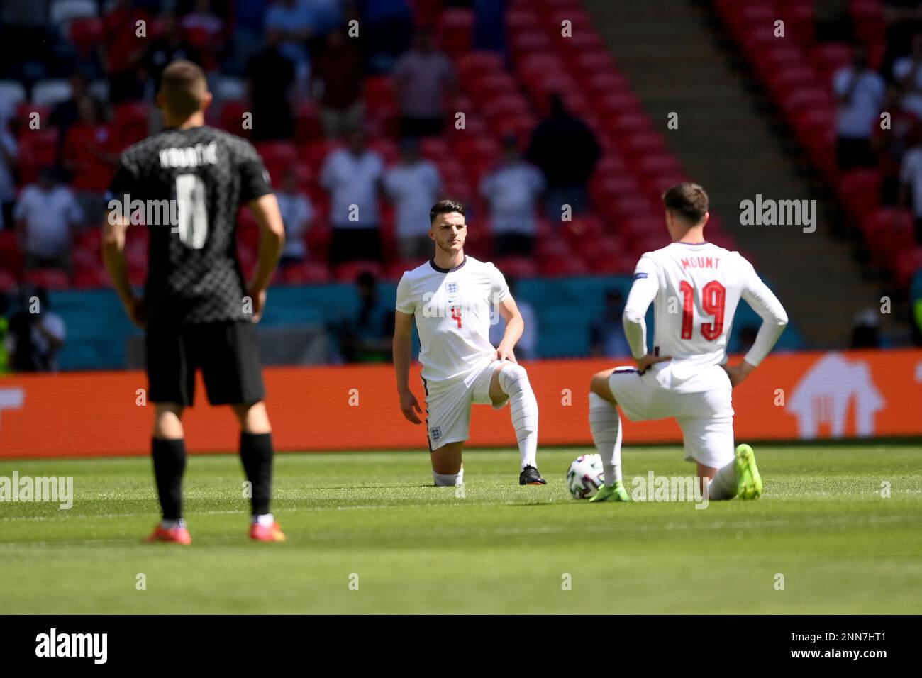 England's Mason Mount, right, and Declan Rice take the knee pair to the ...