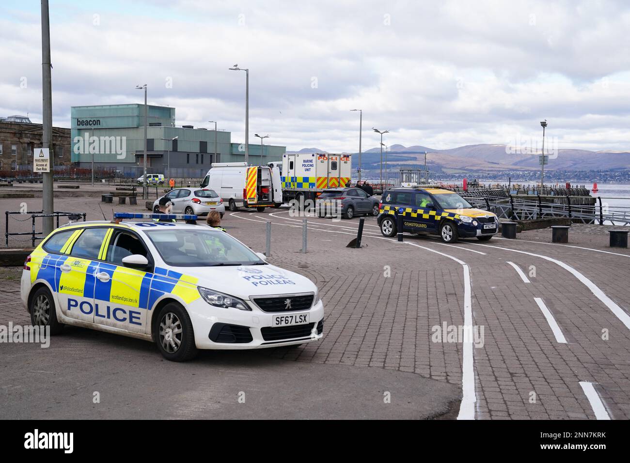 Police officers quayside during the rescue operation in the Firth of ...