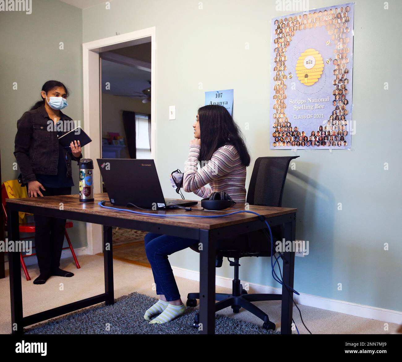 Mrudula Nanduru chats with her daughter, Ananya, as she waits to ...